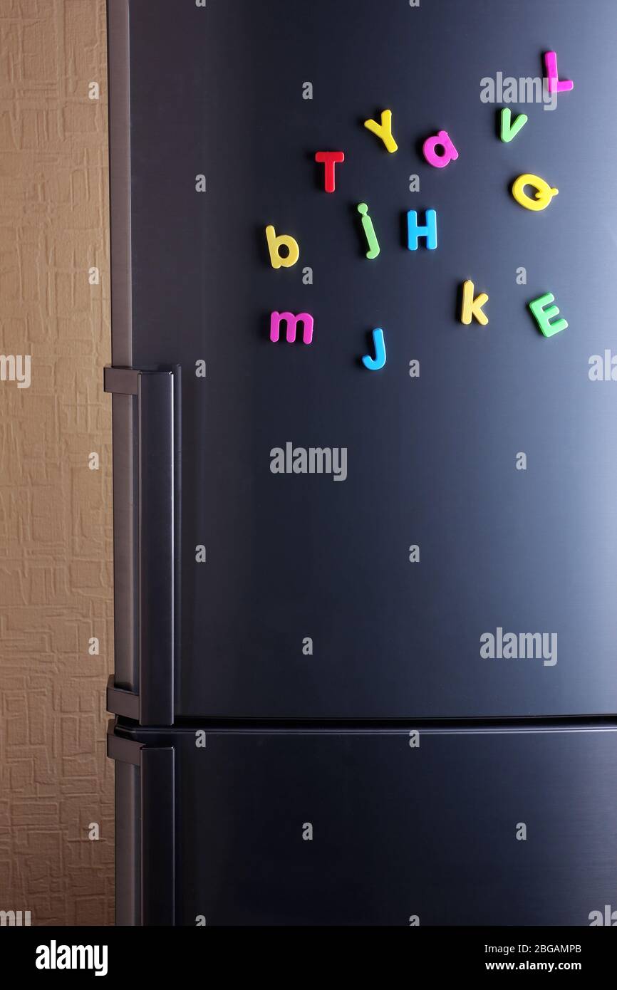 Colorful magnetic letters on refrigerator Stock Photo - Alamy