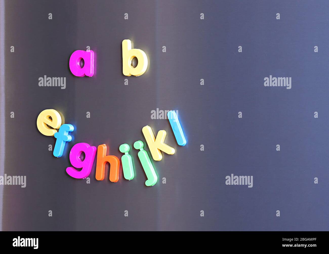 Colorful magnetic letters on refrigerator Stock Photo - Alamy