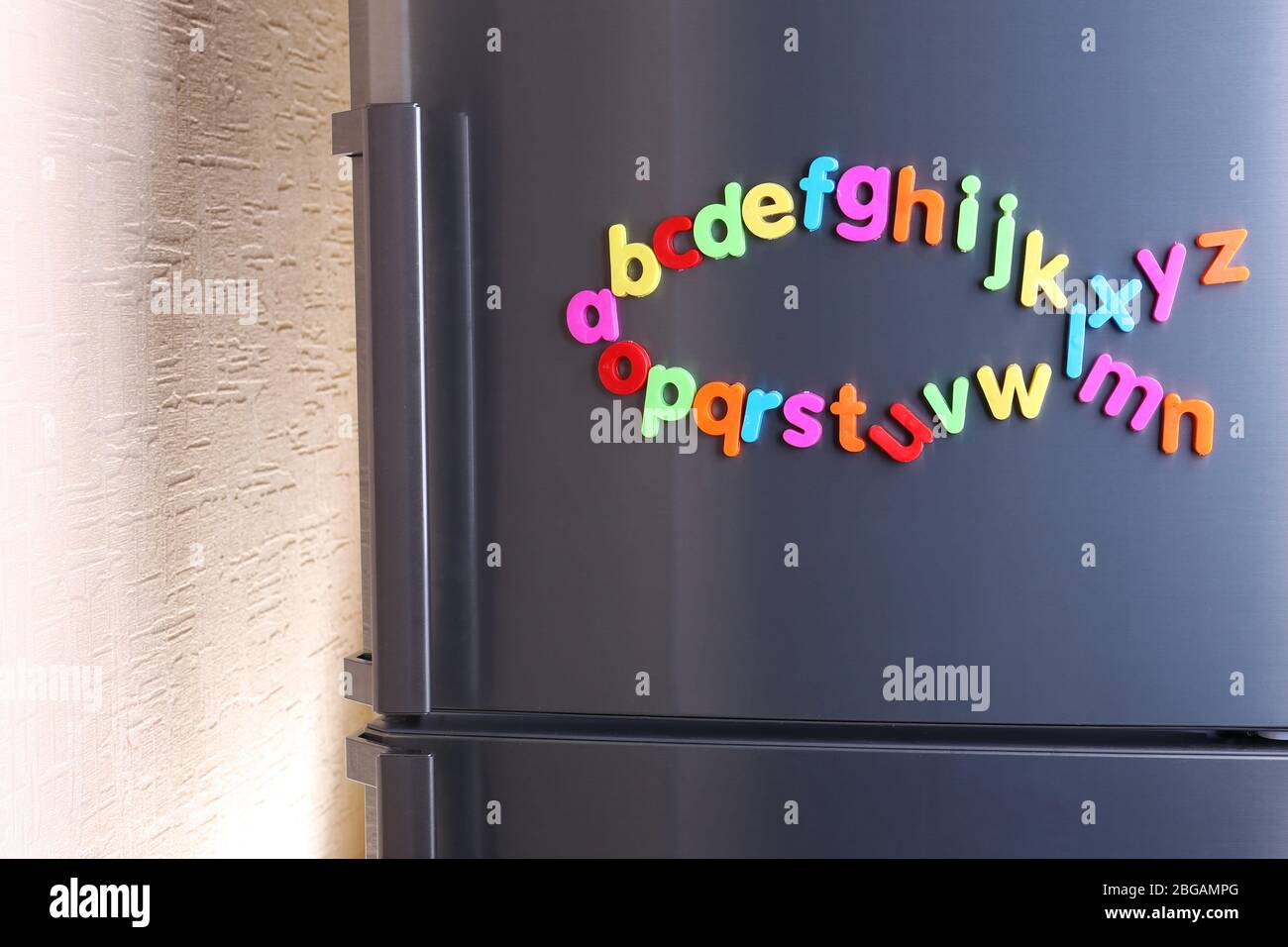 Colorful magnetic letters on refrigerator Stock Photo - Alamy