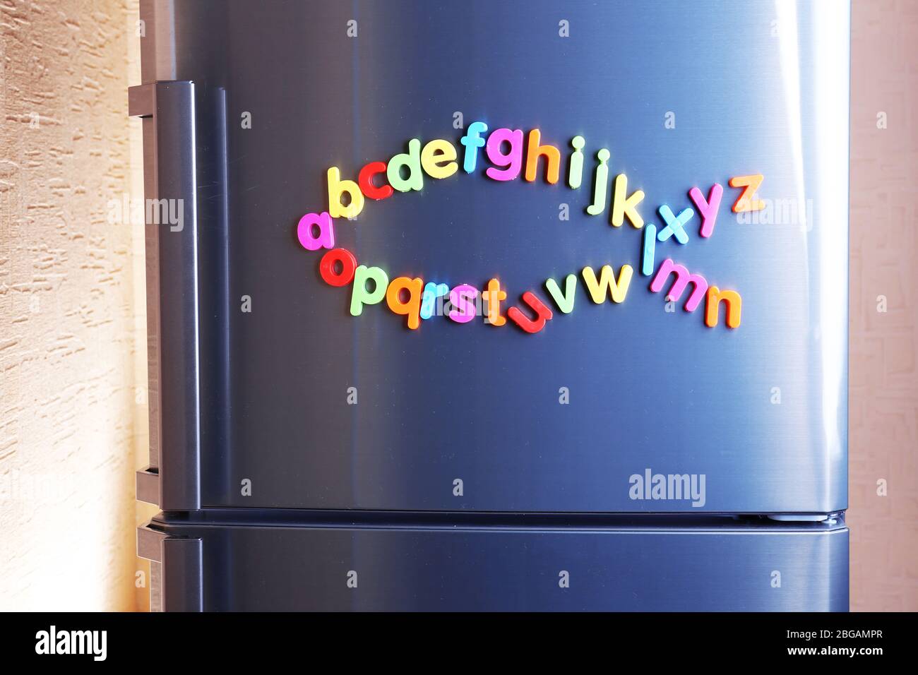 Colorful magnetic letters on refrigerator Stock Photo - Alamy