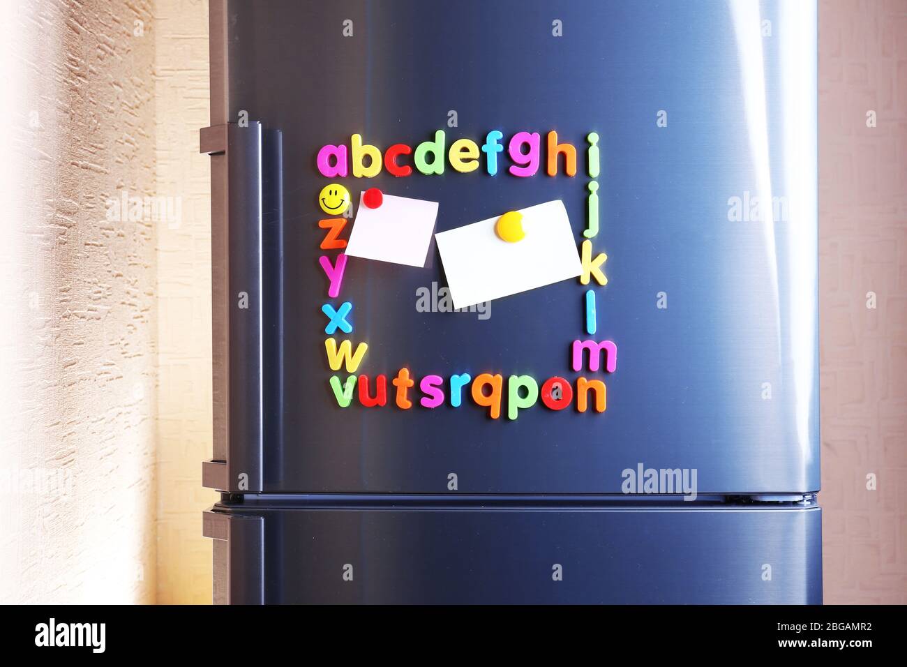 Colorful magnetic letters on refrigerator Stock Photo - Alamy