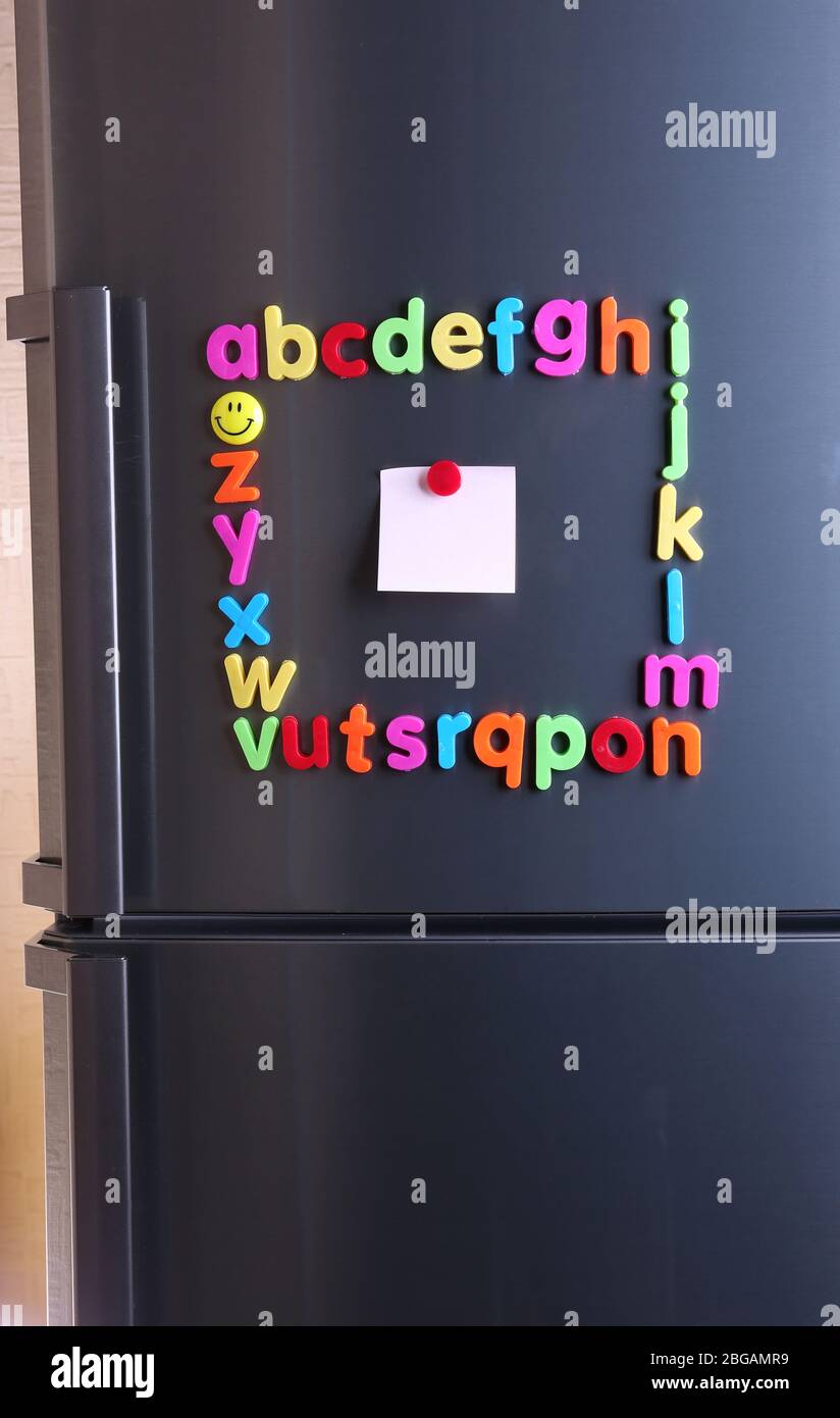 Colorful magnetic letters on refrigerator Stock Photo - Alamy
