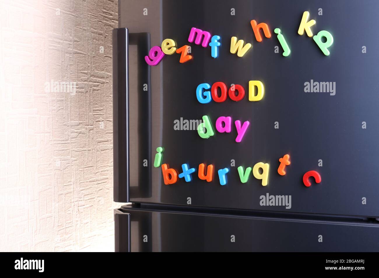 Colorful magnetic letters on refrigerator Stock Photo - Alamy
