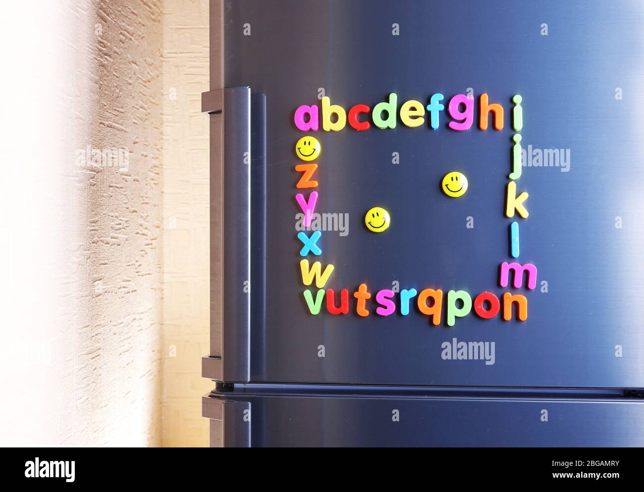 Colorful magnetic letters on refrigerator Stock Photo - Alamy