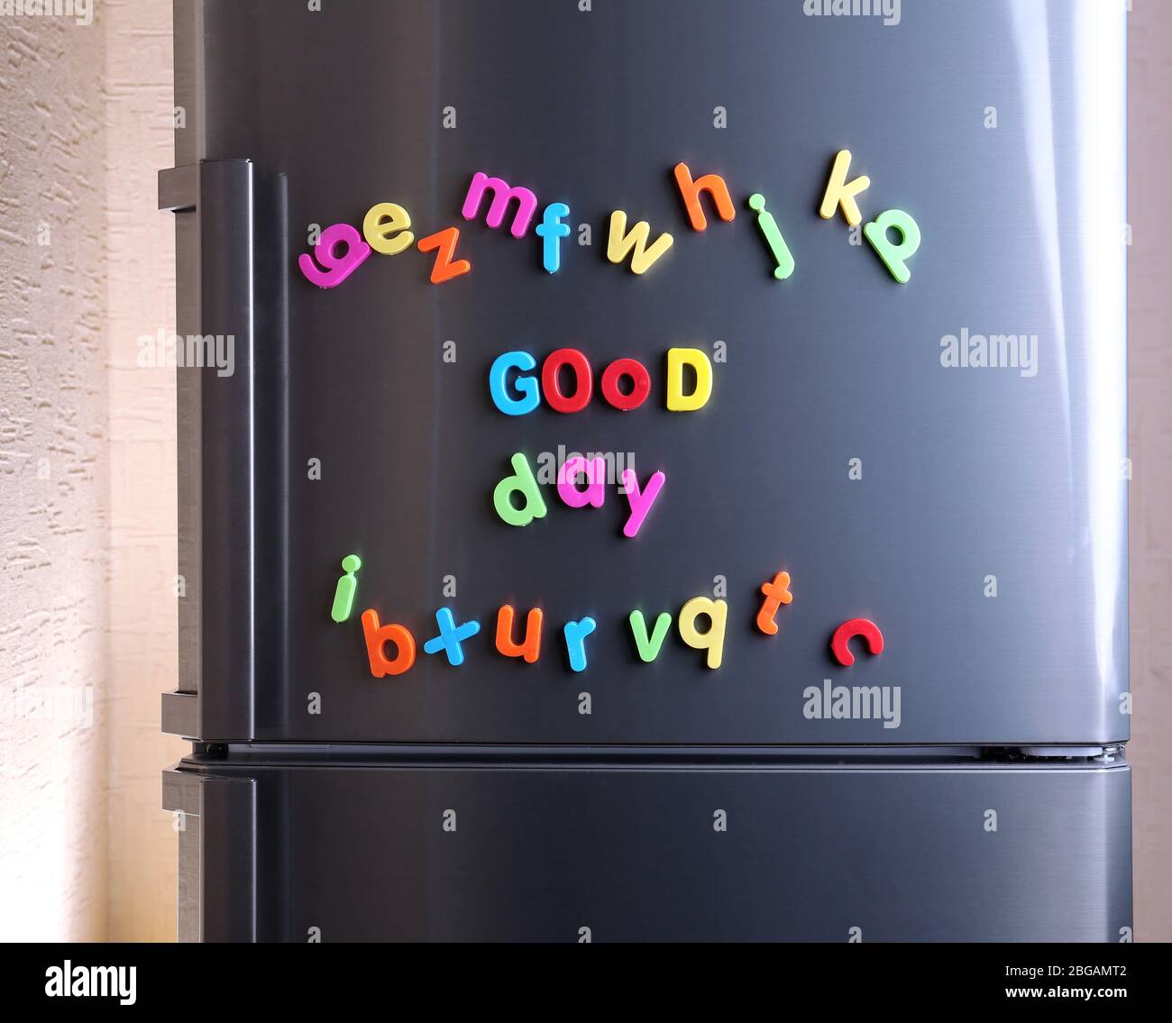 Colorful magnetic letters on refrigerator Stock Photo - Alamy