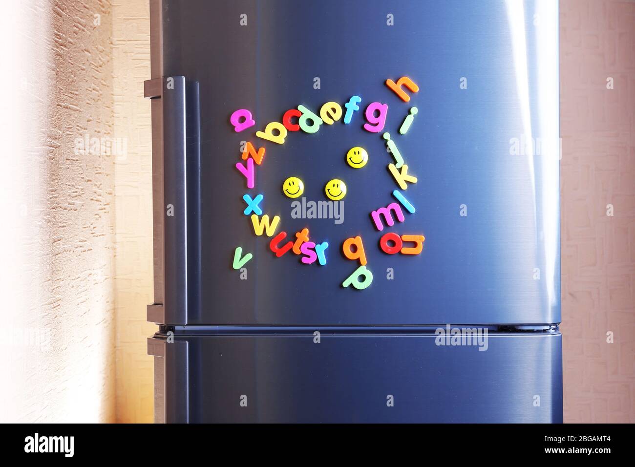 Colorful magnetic letters on refrigerator Stock Photo - Alamy