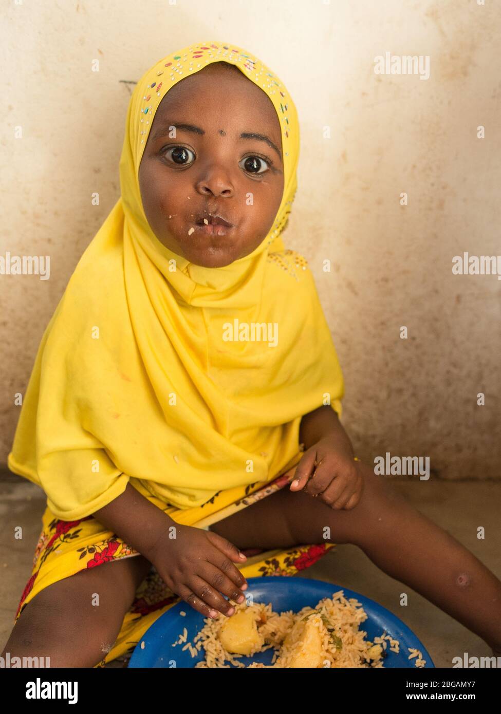 Child eating rice hands hi-res stock photography and images - Alamy