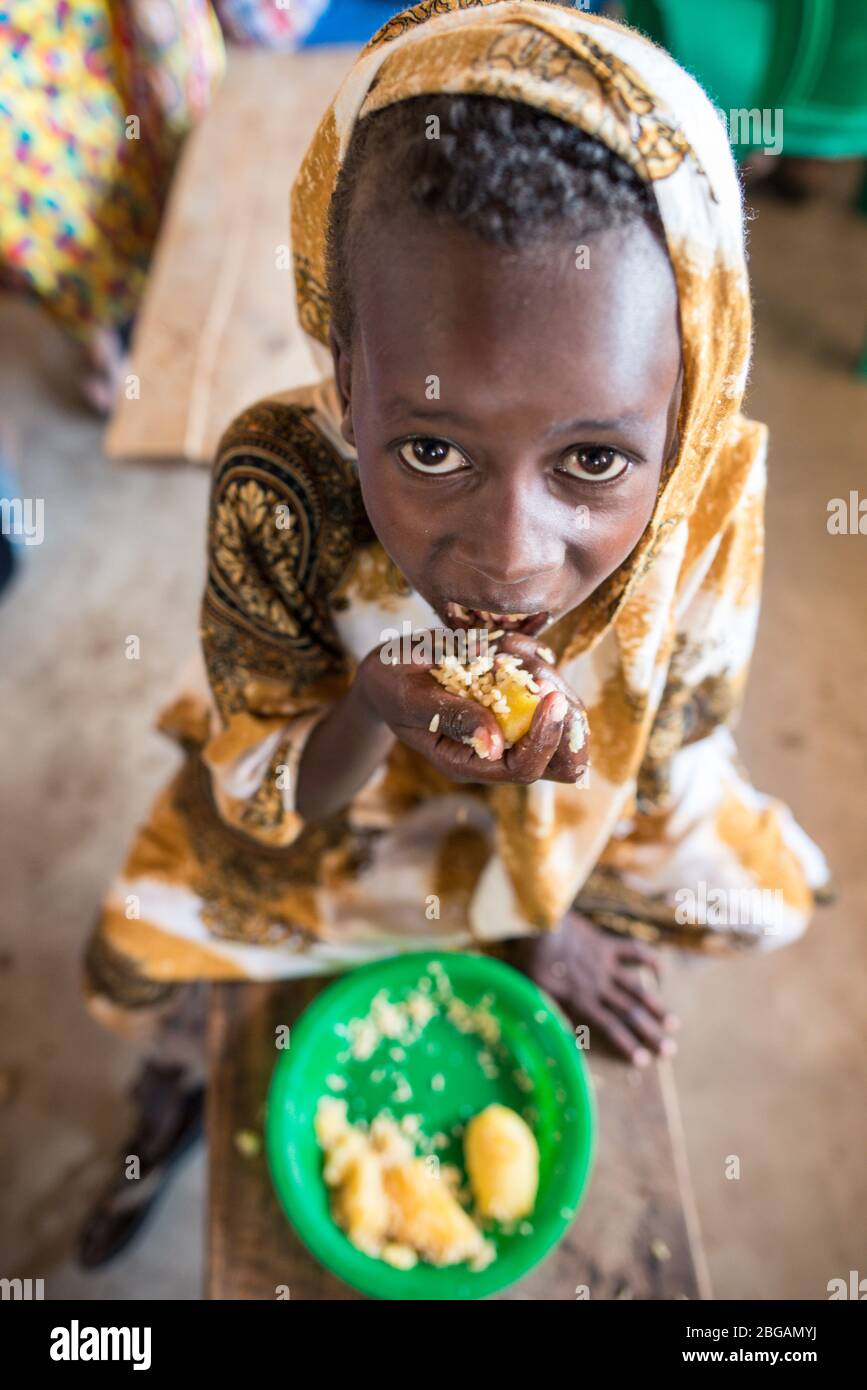 Child eating rice hands hi-res stock photography and images - Alamy