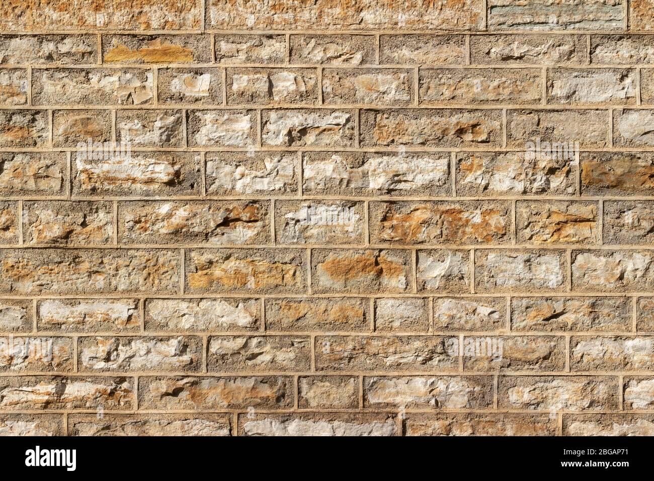 Attractive old preserved 19th Century brown limestone building wall ...