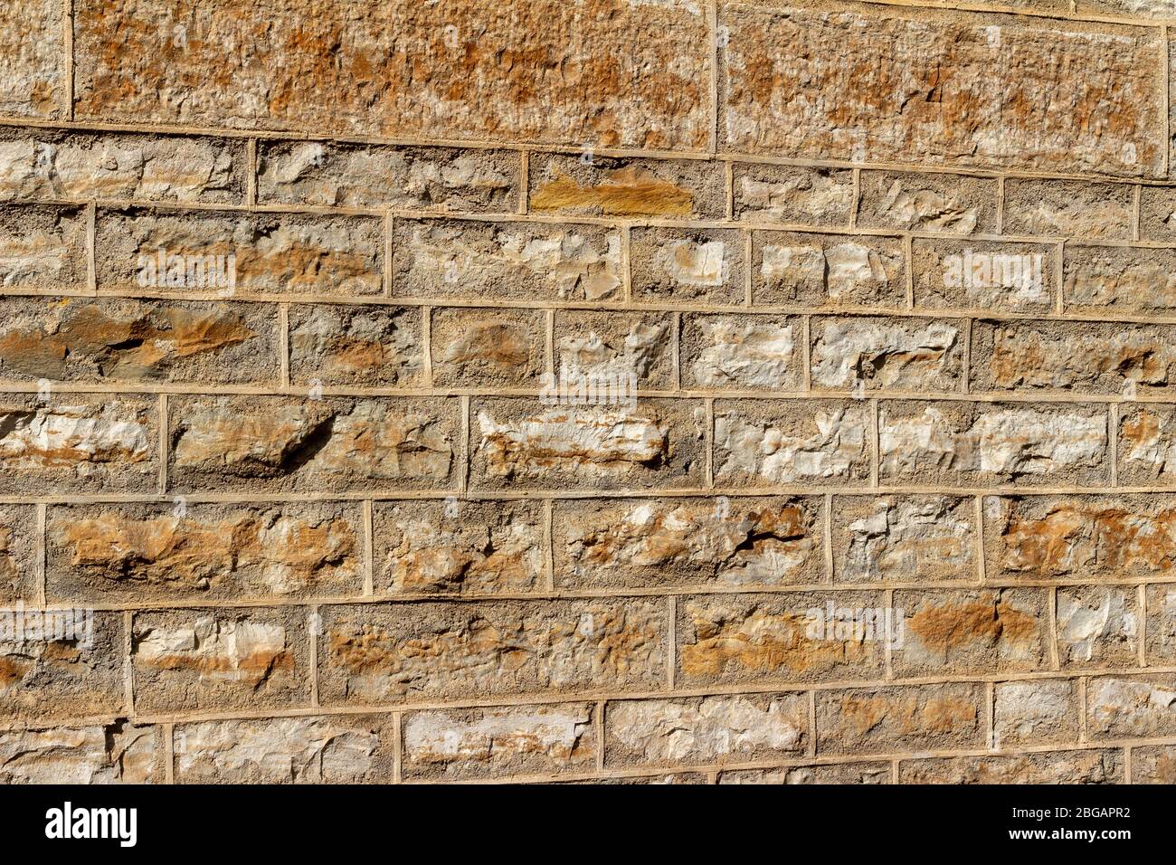 Attractive old preserved 19th Century brown limestone building wall ...