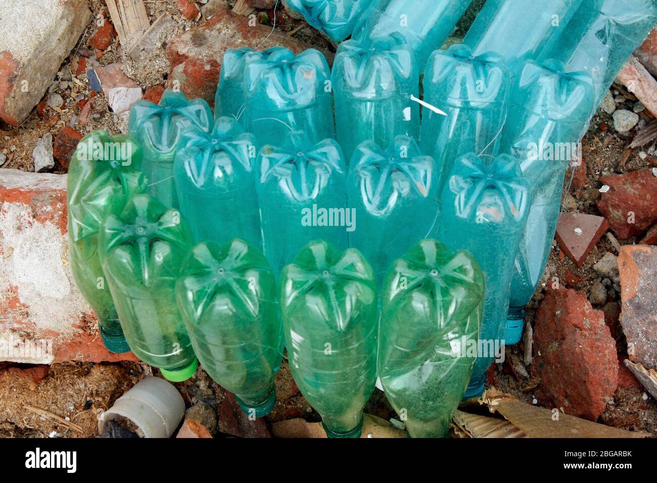 Dirty used plastic bottles pollution. Plastic waste and construction ...