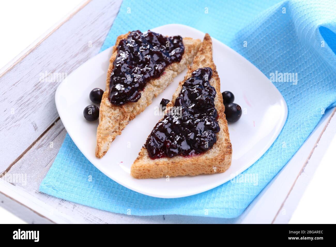 Delicious toast with jam on plate close-up Stock Photo - Alamy