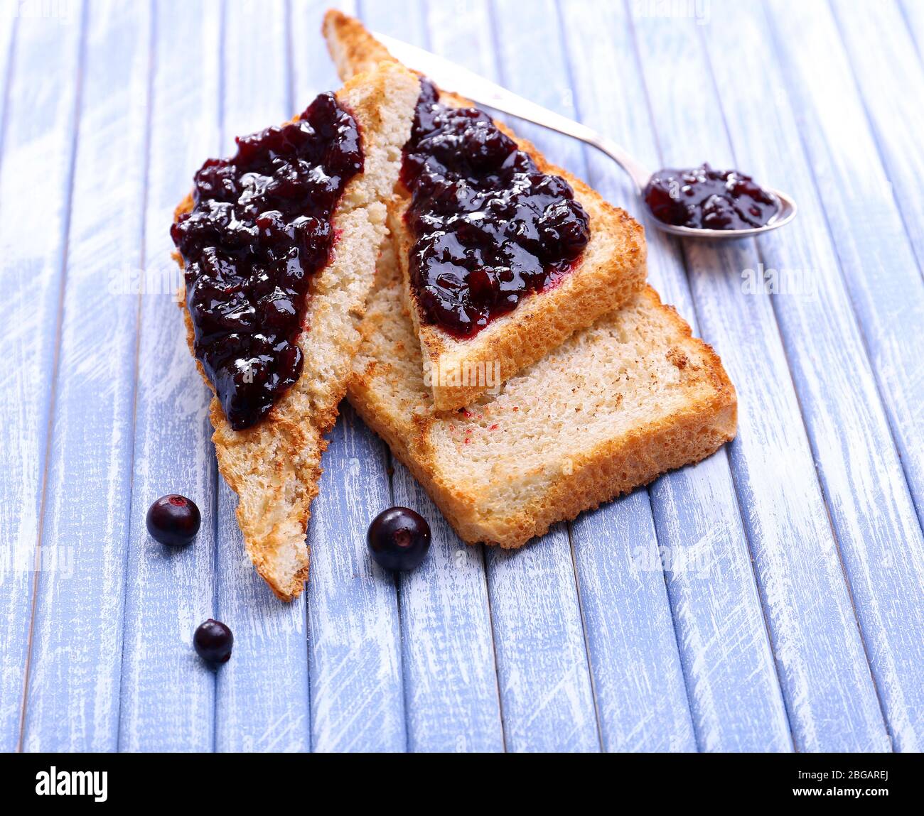 Delicious toast with jam on table close-up Stock Photo - Alamy