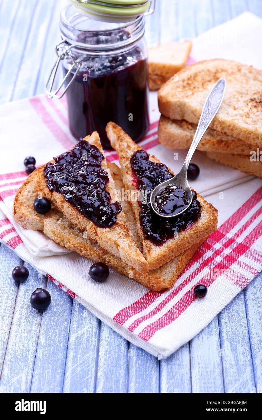 Delicious toast with jam on table close-up Stock Photo - Alamy