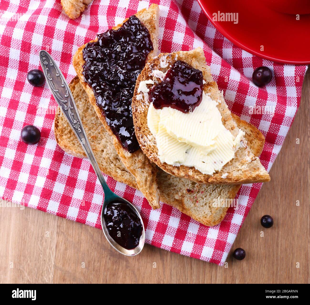 Delicious toast with jam on table close-up Stock Photo - Alamy