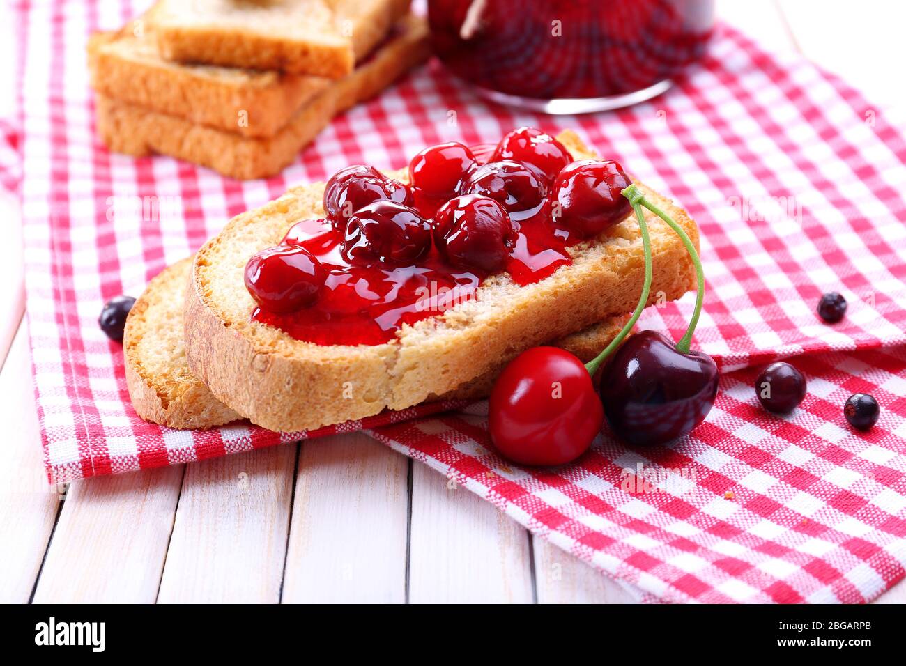 Delicious toast with jam on table close-up Stock Photo - Alamy