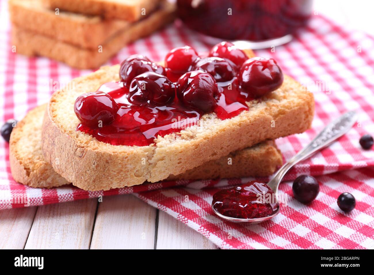 Delicious toast with jam on table close-up Stock Photo - Alamy