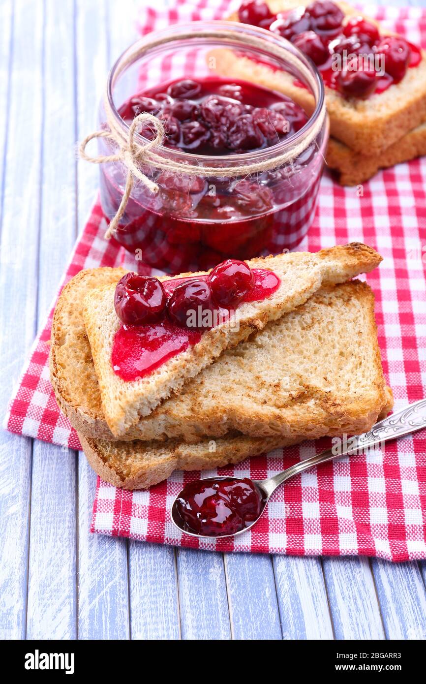 Delicious toast with jam on table close-up Stock Photo - Alamy