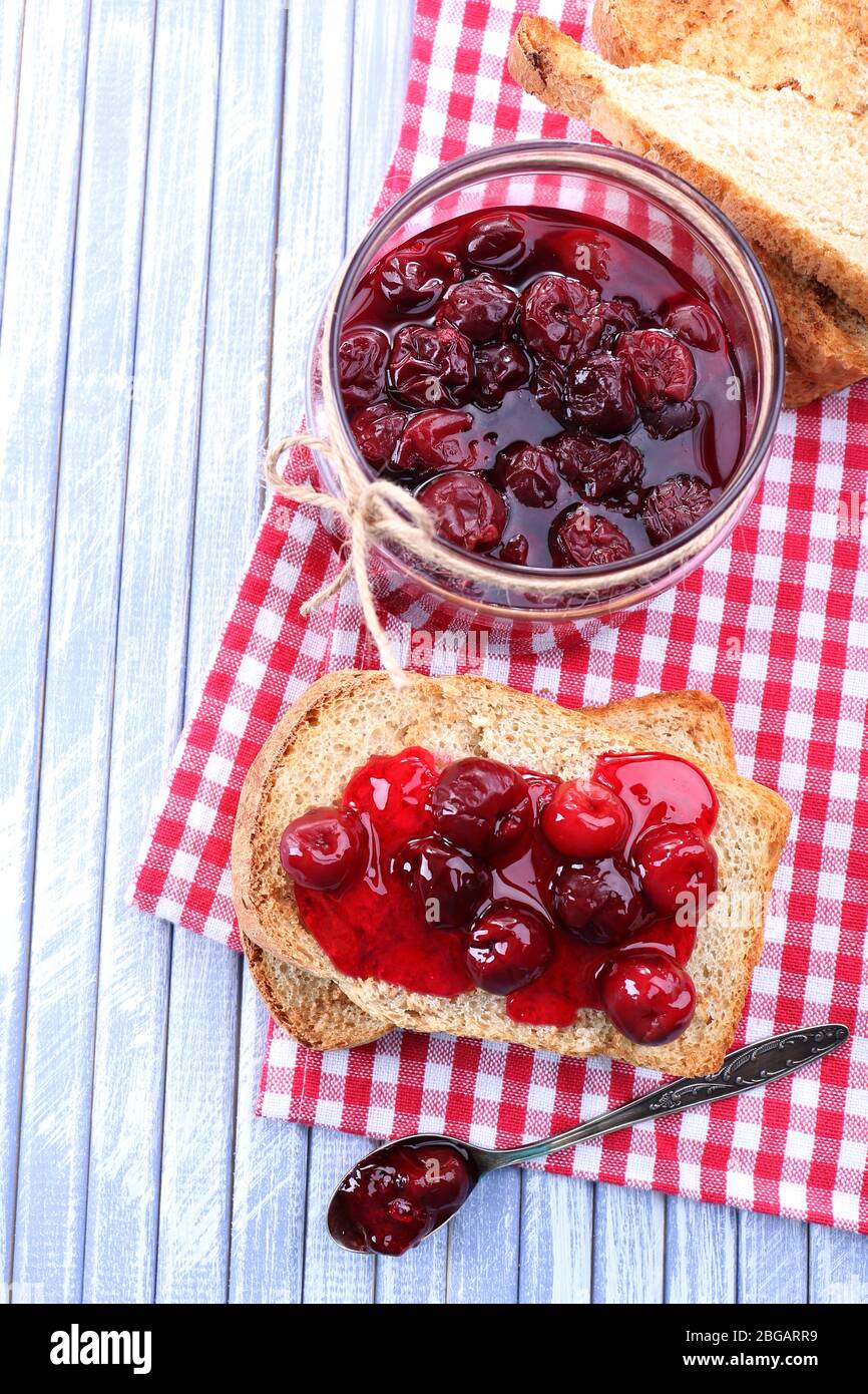 Delicious toast with jam on table close-up Stock Photo - Alamy