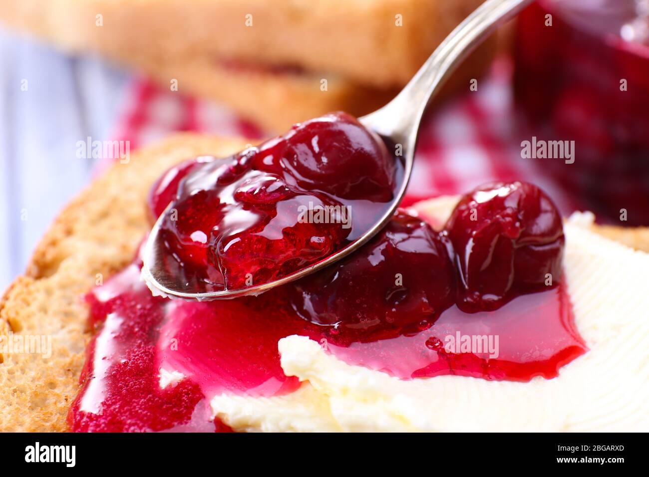 Delicious toast with jam on table close-up Stock Photo - Alamy