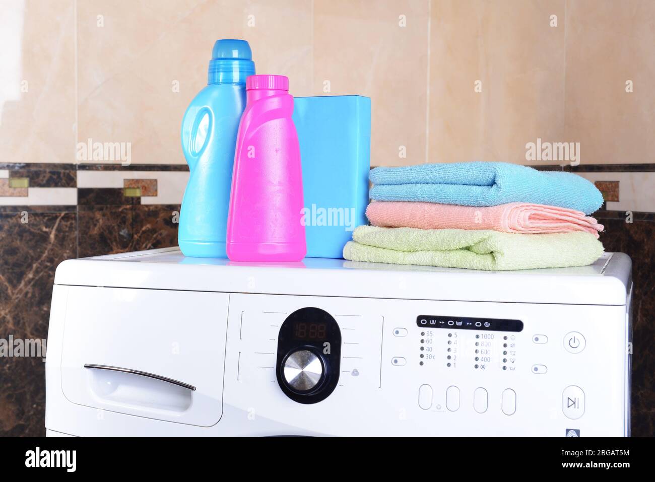 Washing machine with clean clothes close-up Stock Photo - Alamy