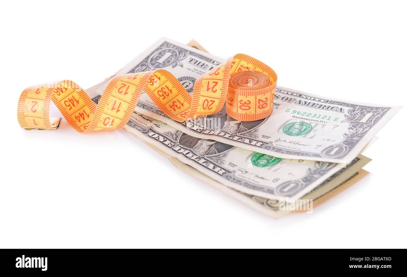 Tape measure with money isolated on white Stock Photo - Alamy