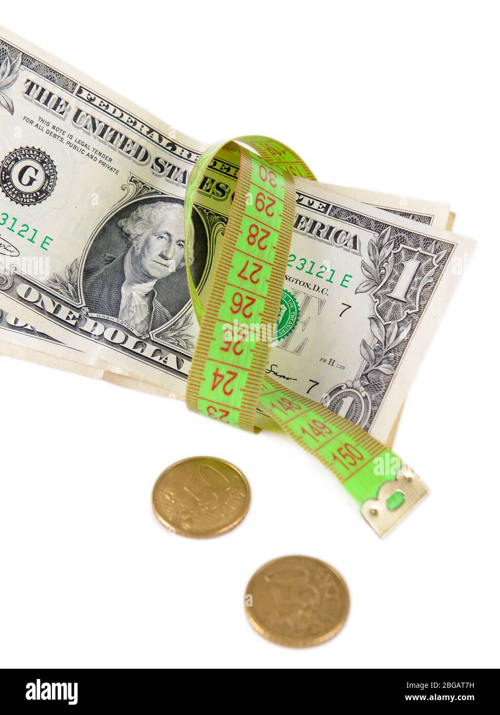 Tape measure with money isolated on white Stock Photo - Alamy