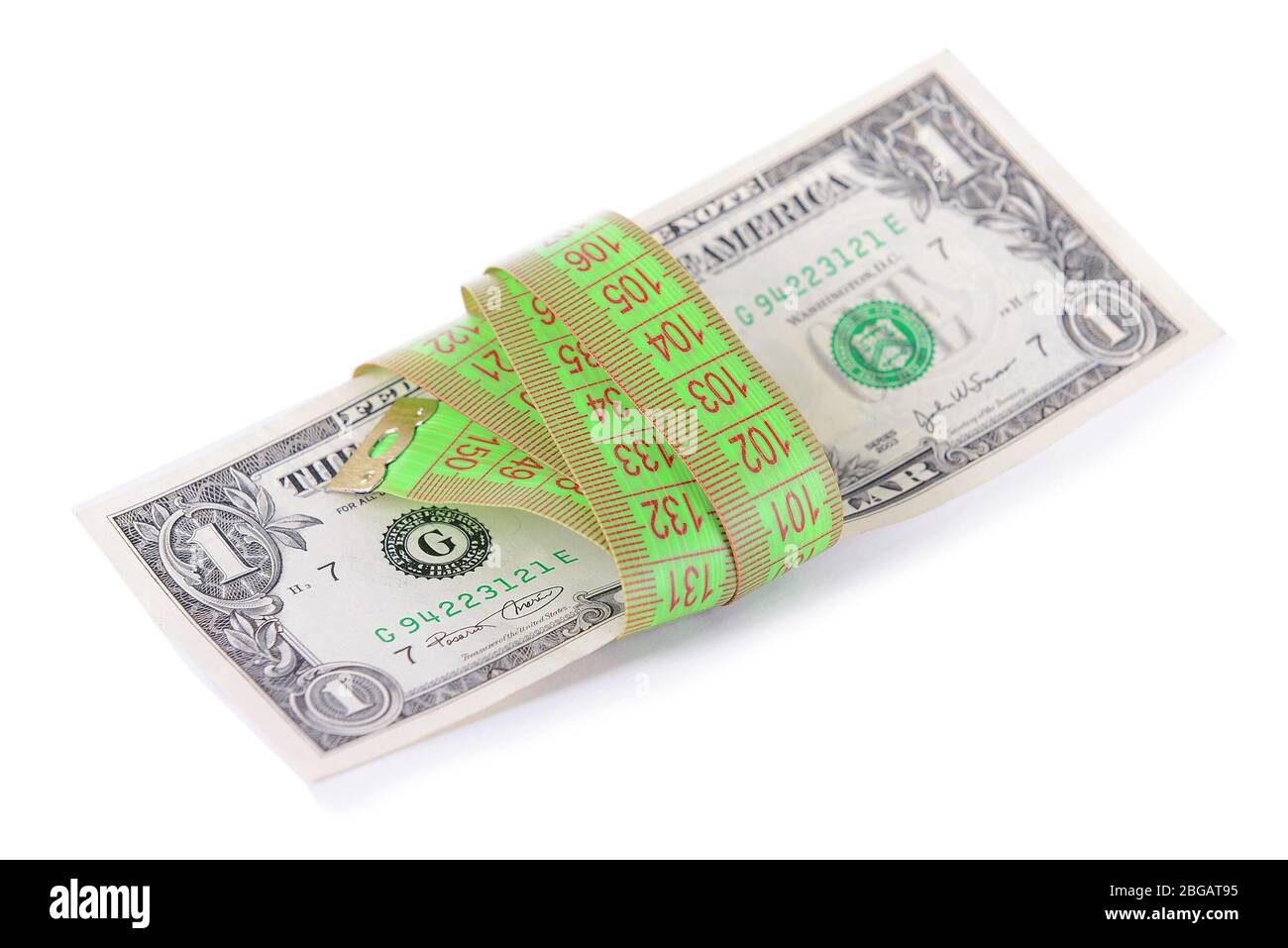 Tape measure with money isolated on white Stock Photo - Alamy