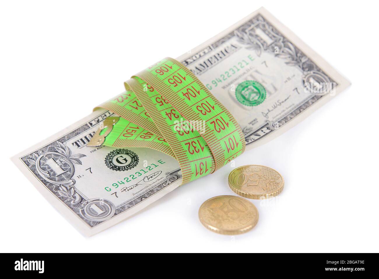 Tape measure with money isolated on white Stock Photo - Alamy