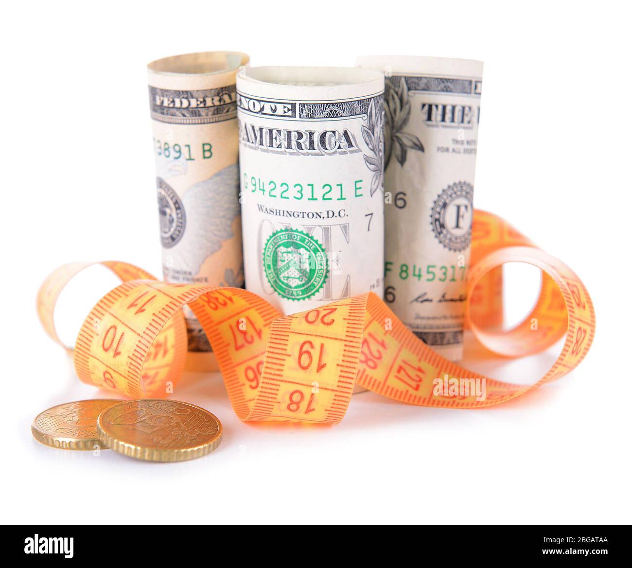 Tape measure with money isolated on white Stock Photo - Alamy