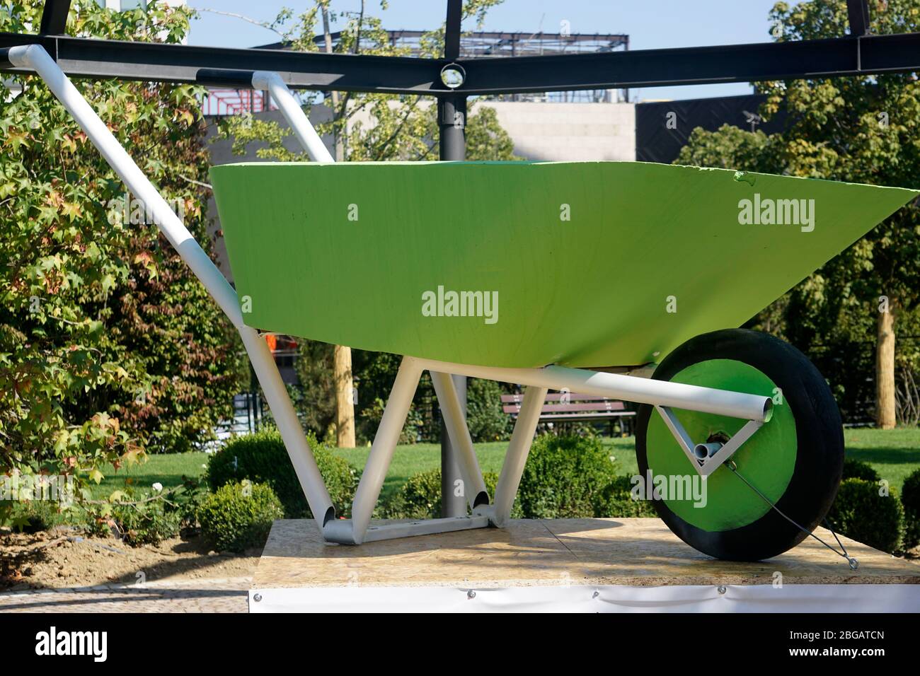 Oversized green, new and empty wheelbarrow use for gardening or ...