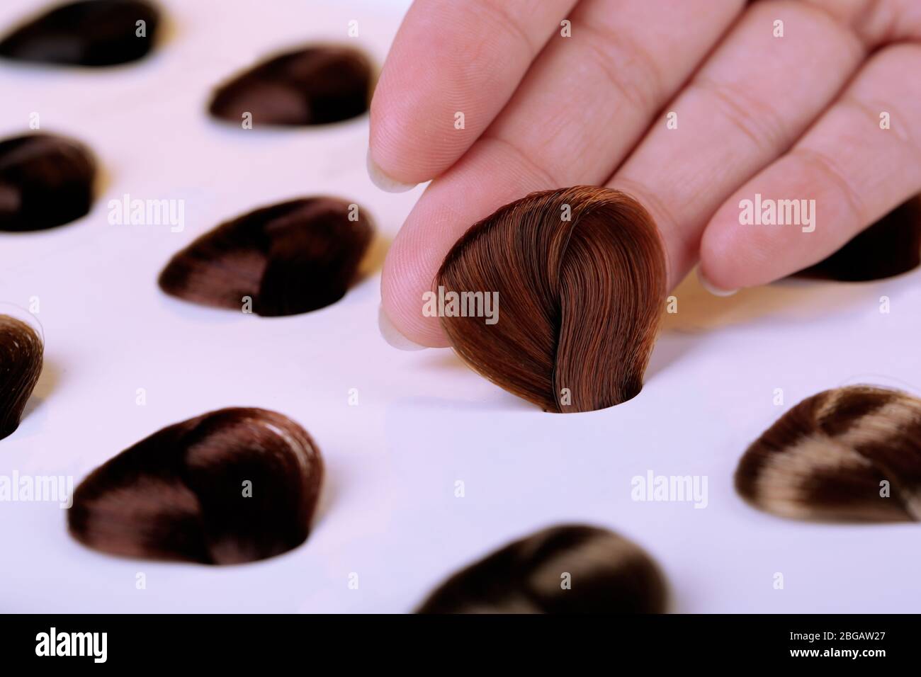 Hair samples of different colors on white background Stock Photo - Alamy