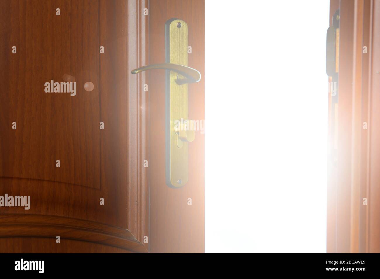 Open door with light outside Stock Photo - Alamy