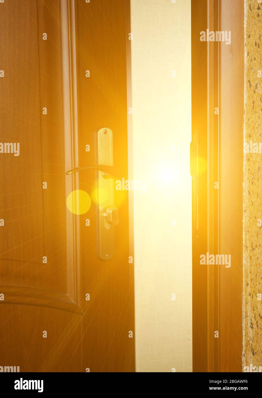 Open door with light outside Stock Photo - Alamy