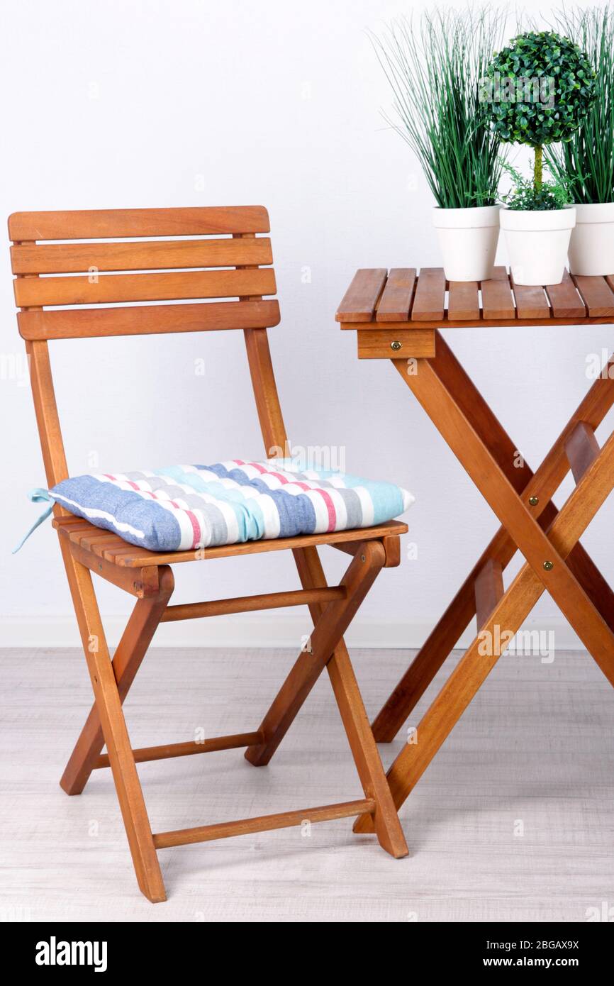 Garden chair and table isolated on white Stock Photo - Alamy
