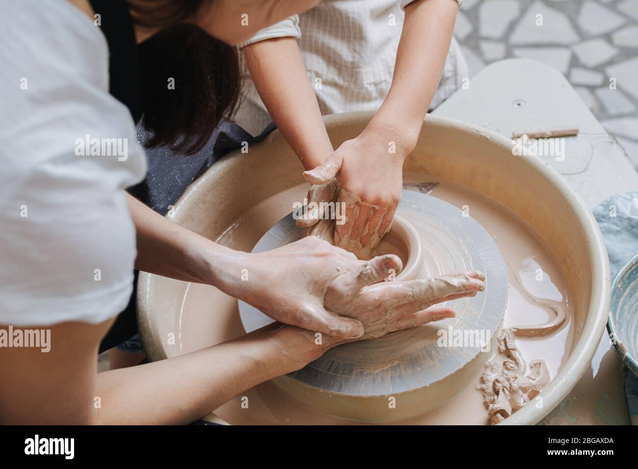 Hands shaping clay on a wheel hi-res stock photography and images - Alamy