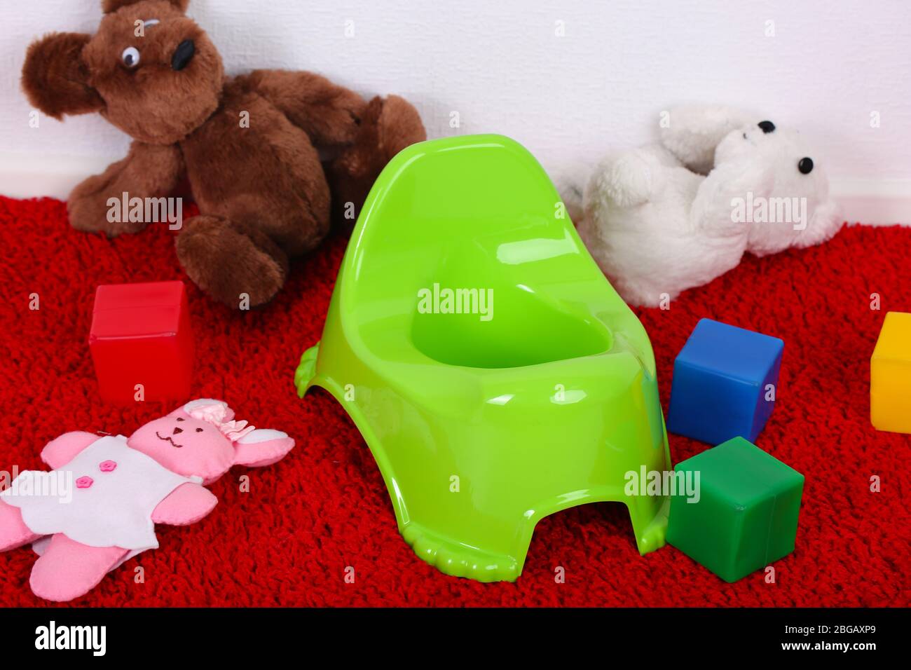 Green potty on home interior background Stock Photo - Alamy