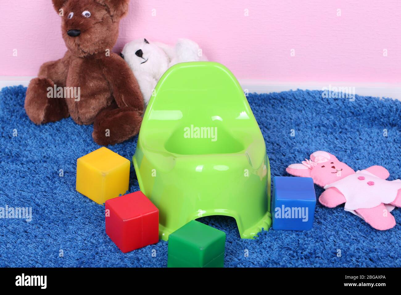 Green potty on home interior background Stock Photo - Alamy