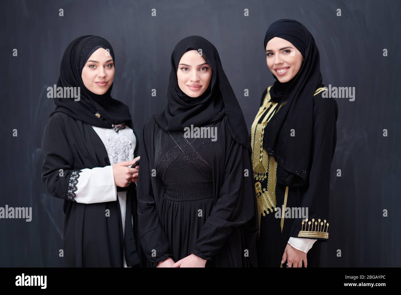 group portrait of beautiful muslim women in fashionable dress with ...
