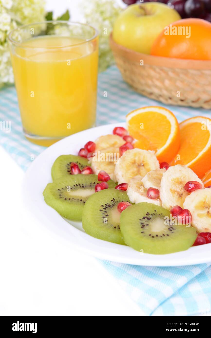 Sweet fresh fruits on plate on table close-up Stock Photo - Alamy