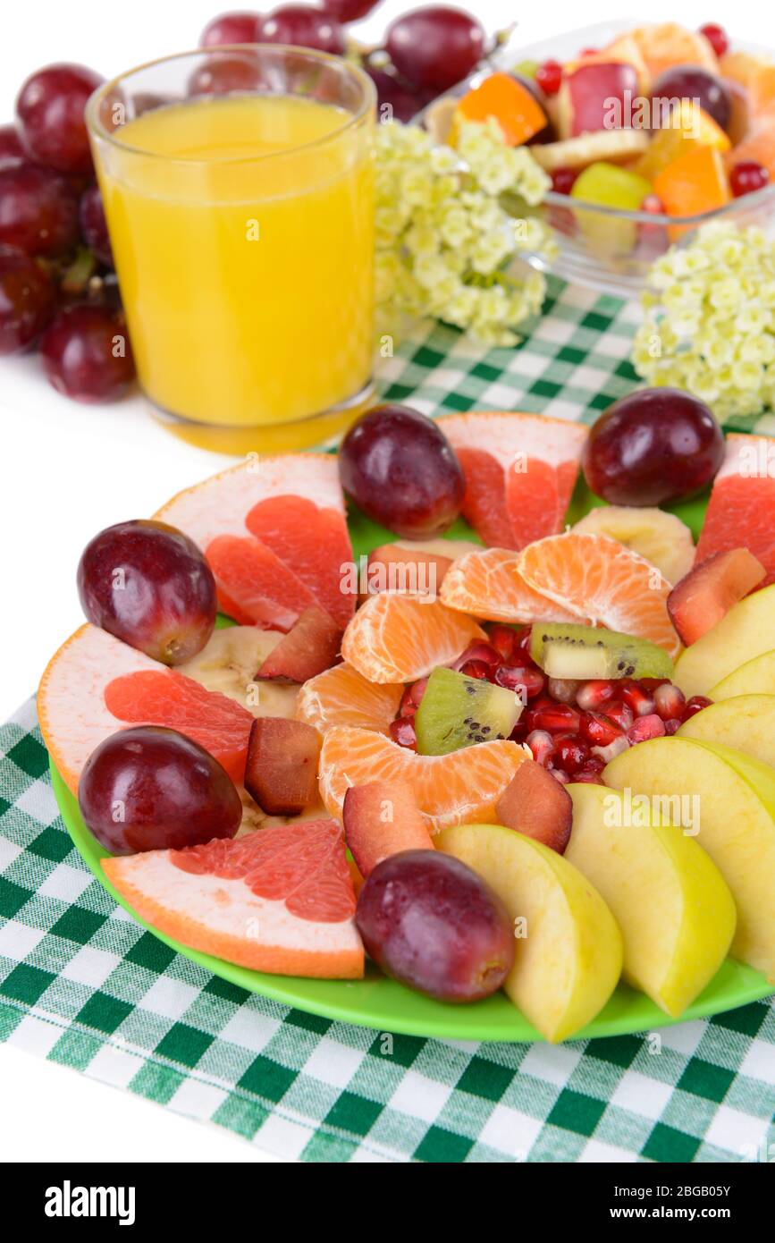 Sweet fresh fruits on plate on table close-up Stock Photo - Alamy