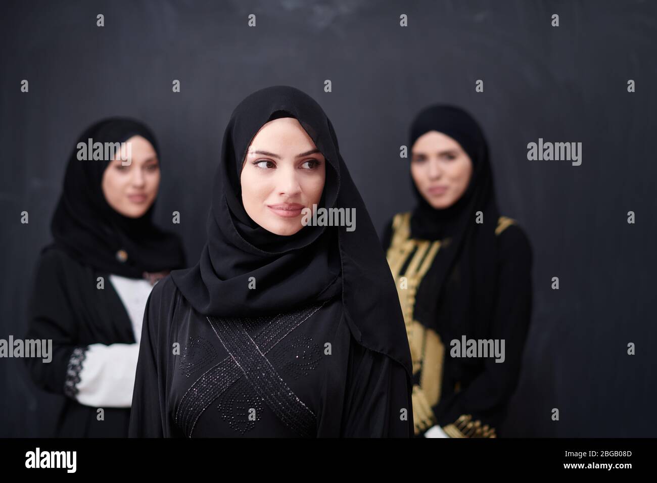 group portrait of beautiful muslim women in fashionable dress with ...