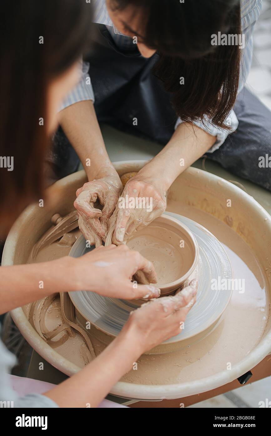 Women making pottery hi-res stock photography and images - Alamy