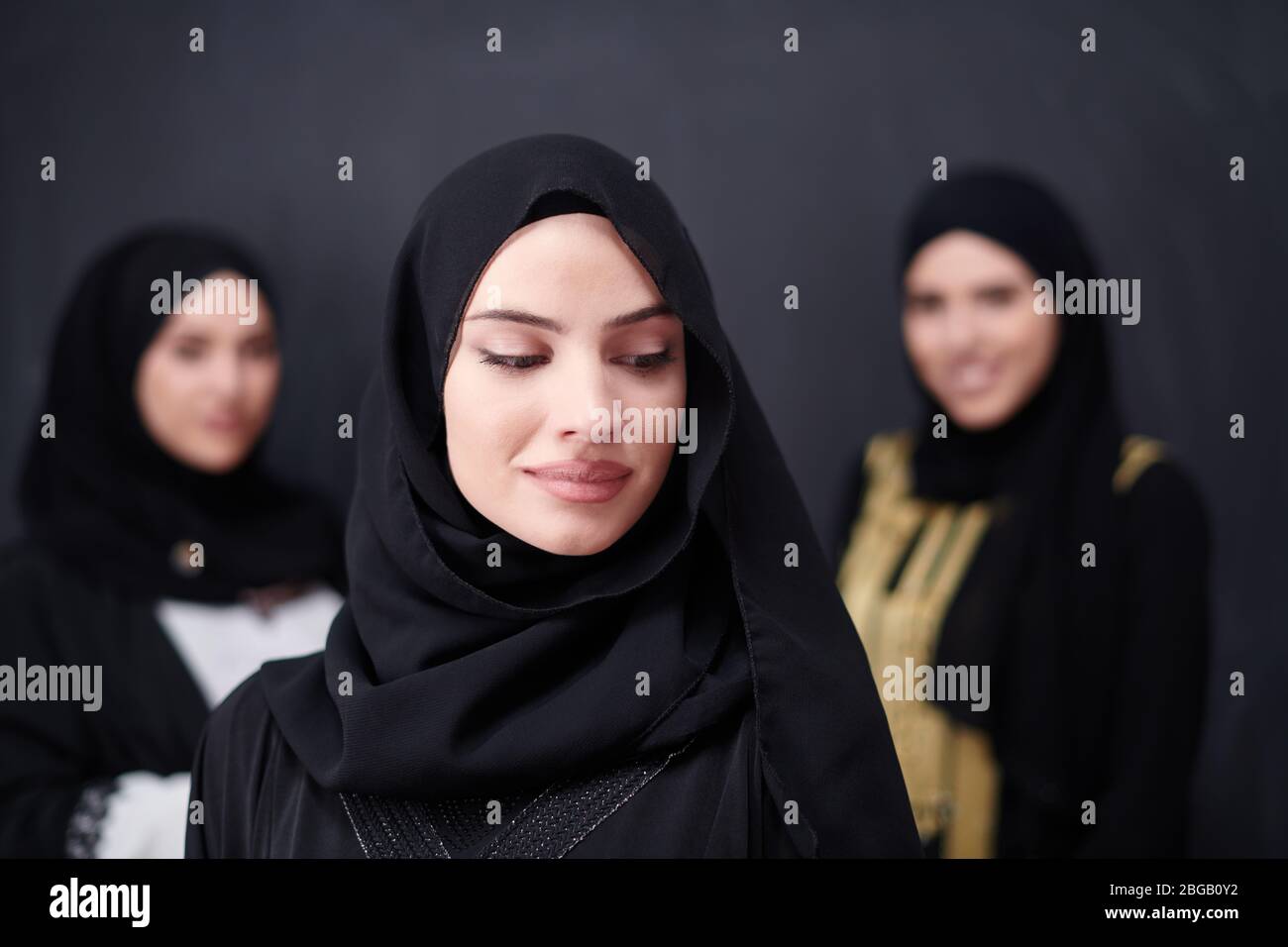 group portrait of beautiful muslim women in fashionable dress with ...