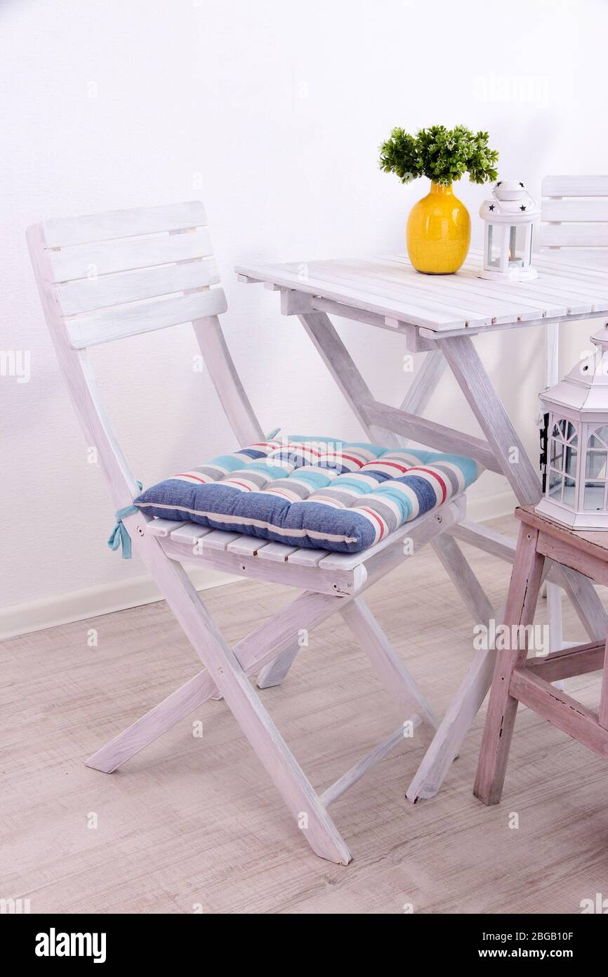 Garden chairs and table with flowers on white background Stock Photo ...