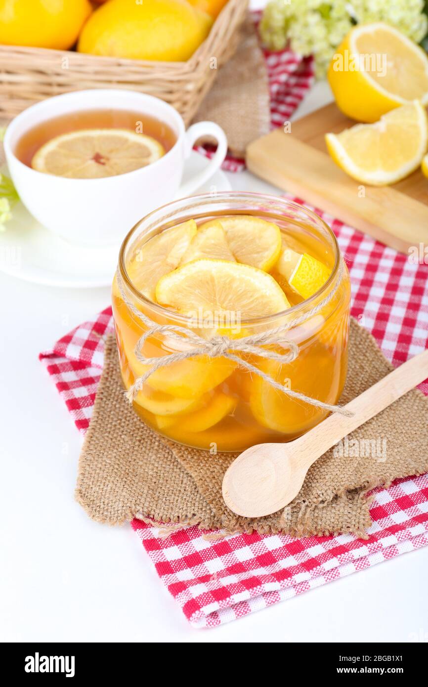 Tasty lemon jam with cup of tea on table close-up Stock Photo - Alamy