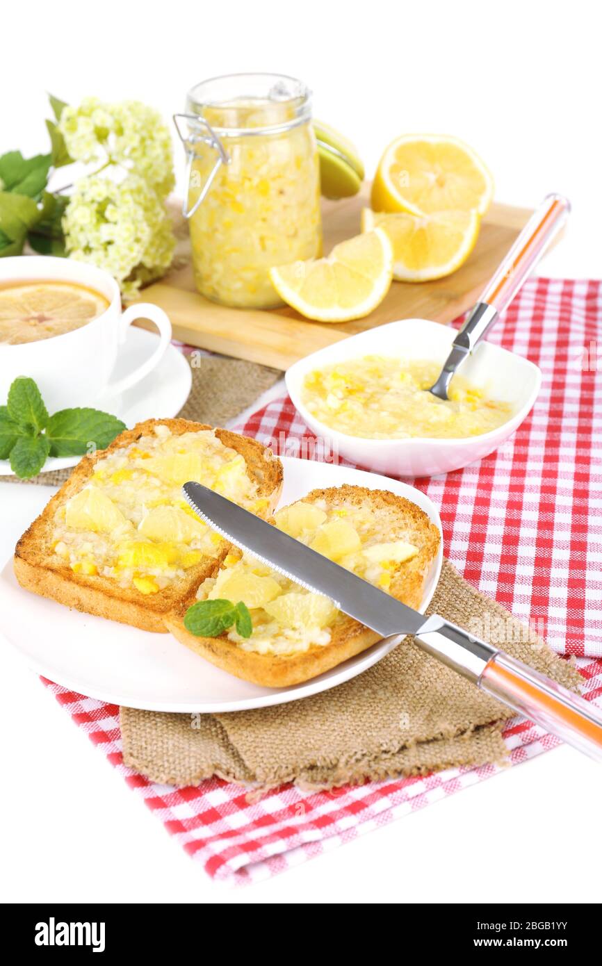 Delicious toasts with lemon jam on plate on table close-up Stock Photo ...
