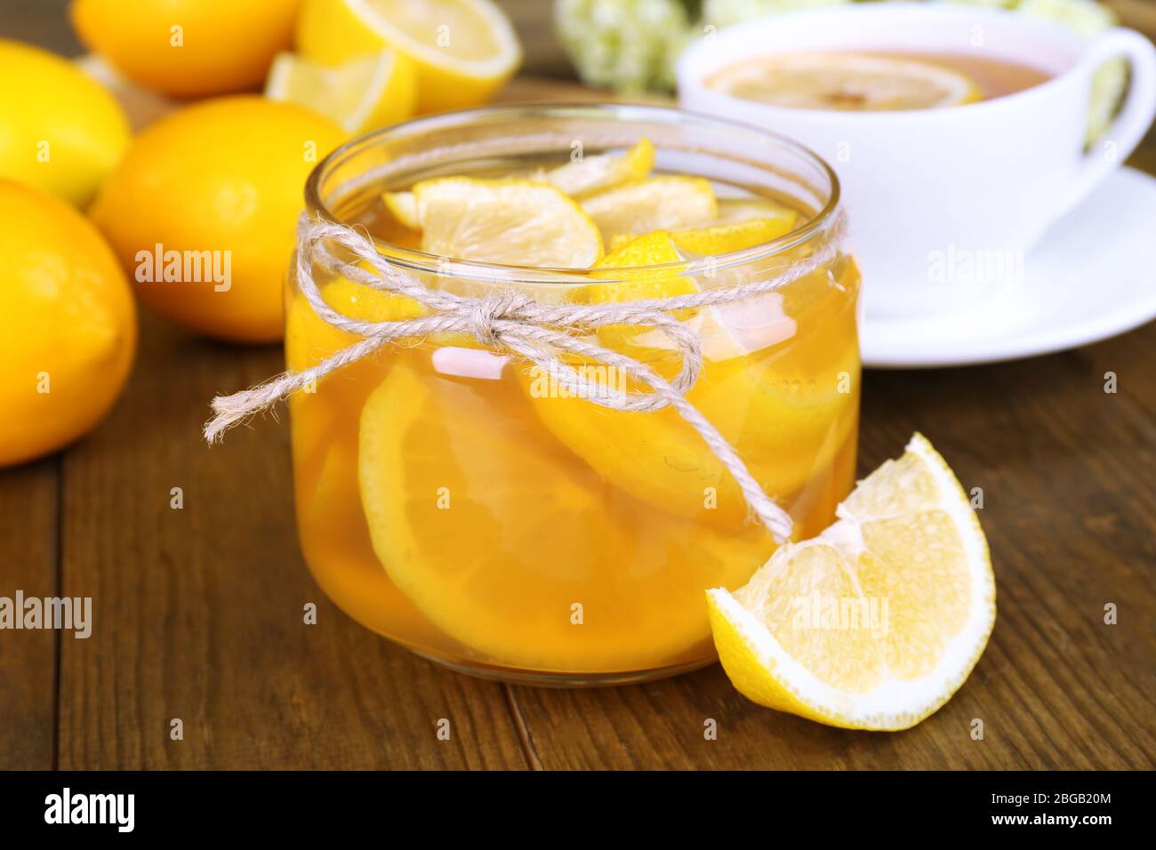 Tasty lemon jam with cup of tea on table close-up Stock Photo - Alamy