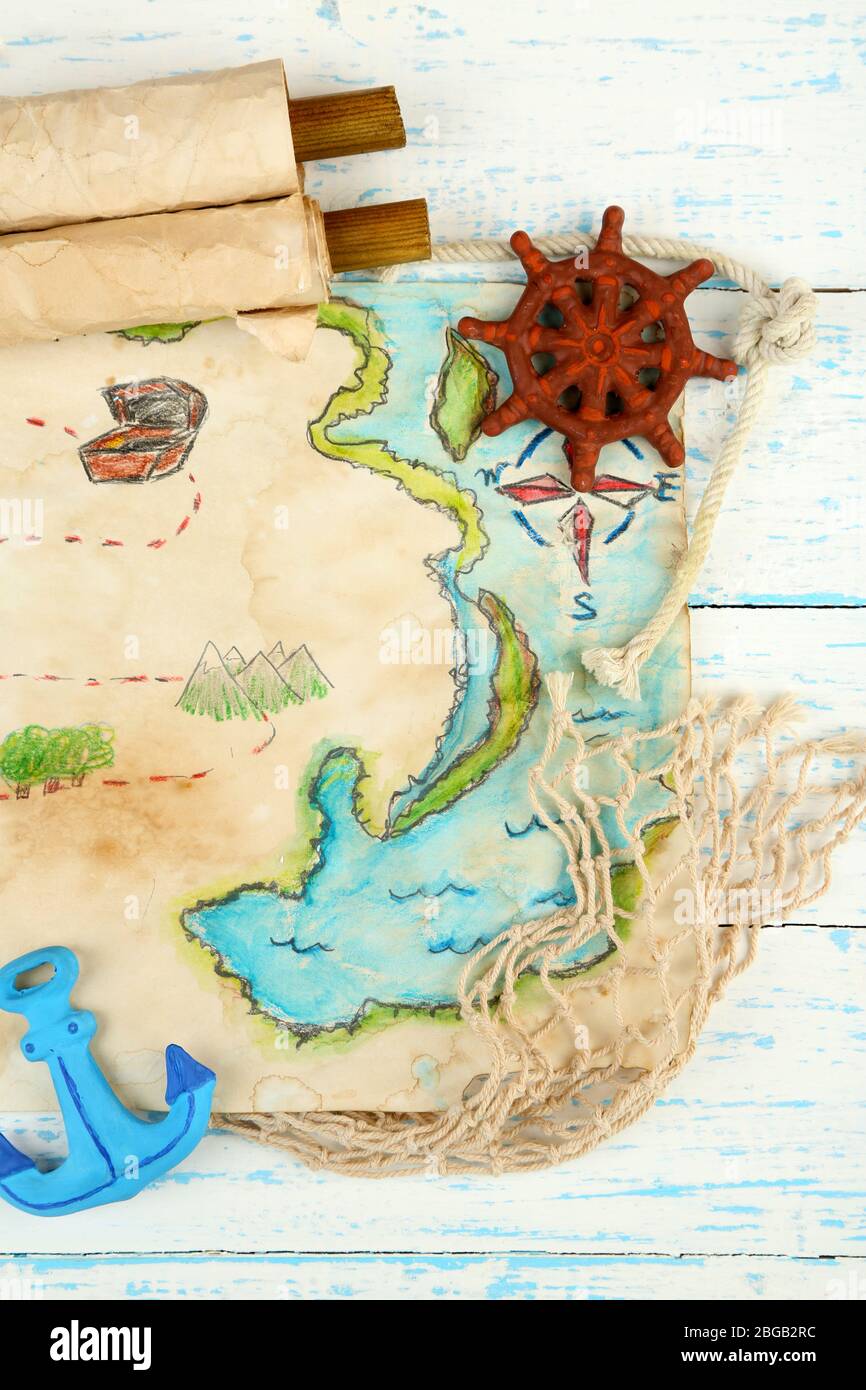 Treasure map with sea accessories, on wooden background Stock Photo - Alamy