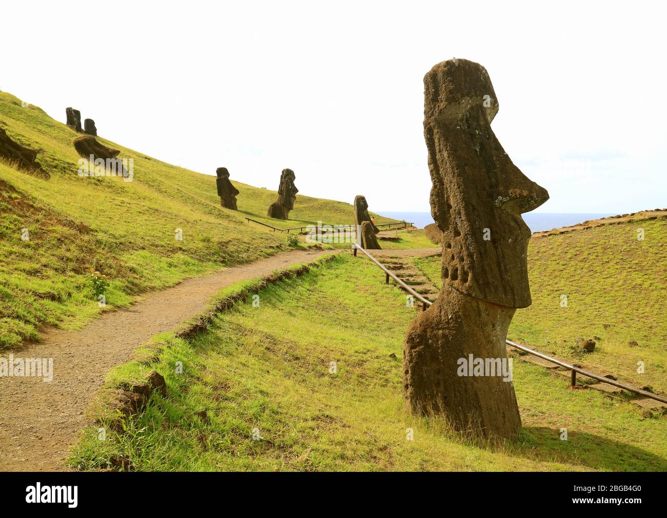 Sightseeing path among large group of abandoned giant Moai statues on ...